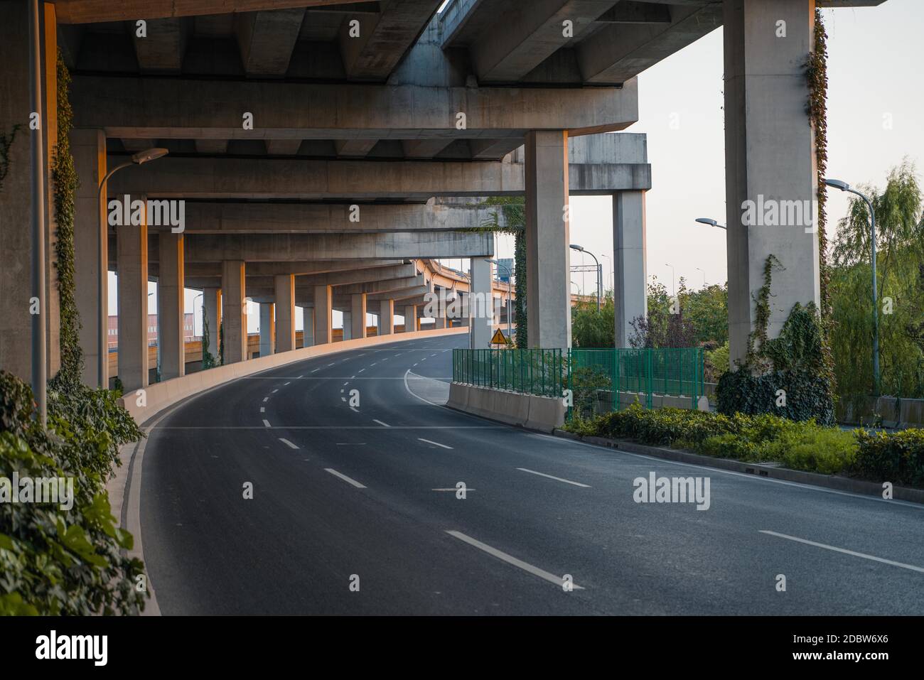 Urban road under overpass bridge Stock Photo - Alamy
