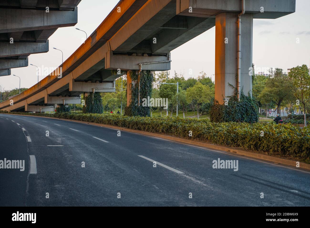 Urban road under overpass bridge Stock Photo - Alamy