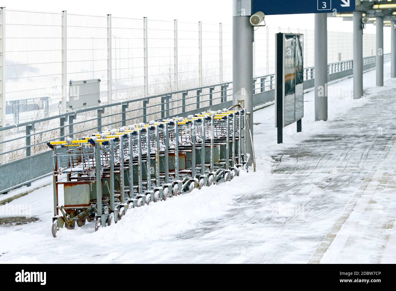 Luggage trolleys at train platform with snow Stock Photo - Alamy