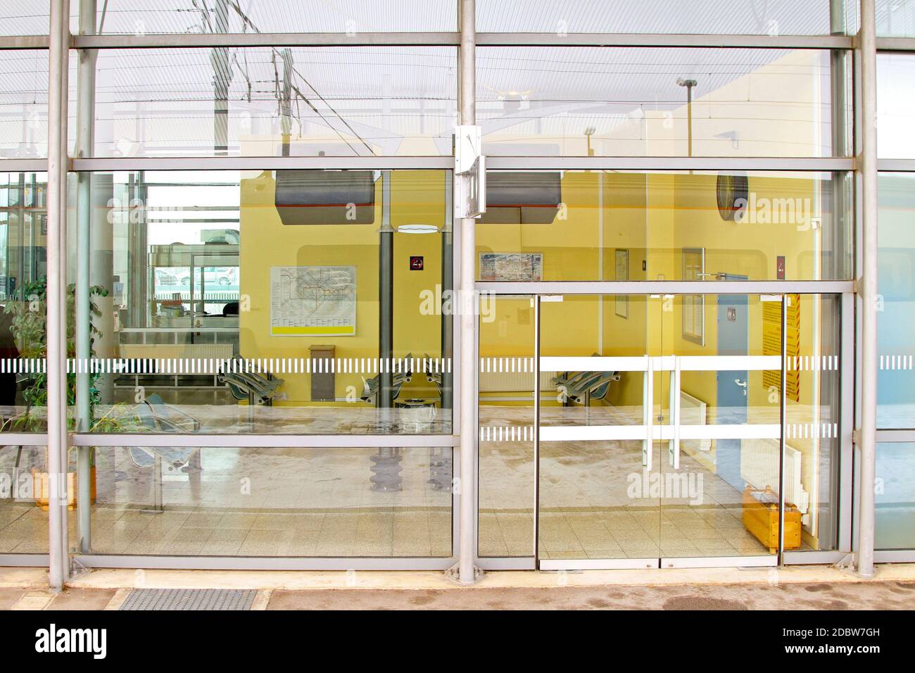 Waiting room in glass at train terminal Stock Photo - Alamy