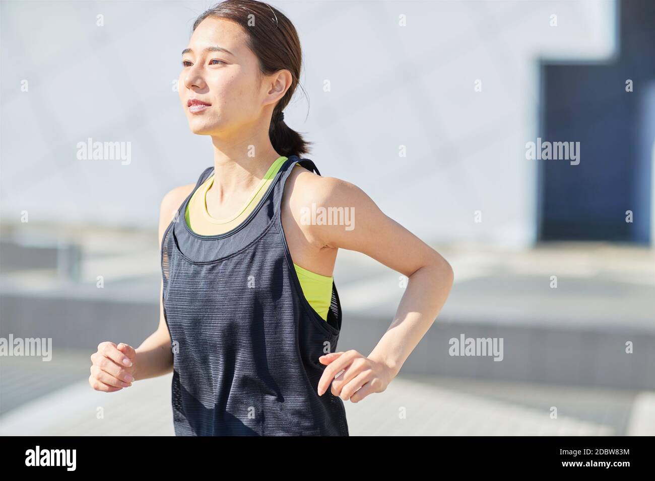Young Japanese Woman Running Downtown Tokyo, Japan Stock Photo - Alamy