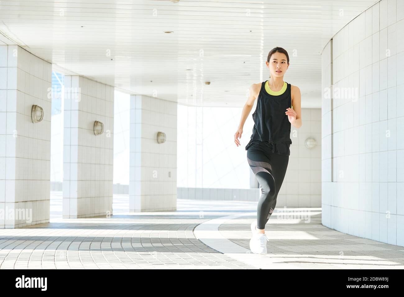 Young Japanese Woman Running Downtown Tokyo, Japan Stock Photo - Alamy