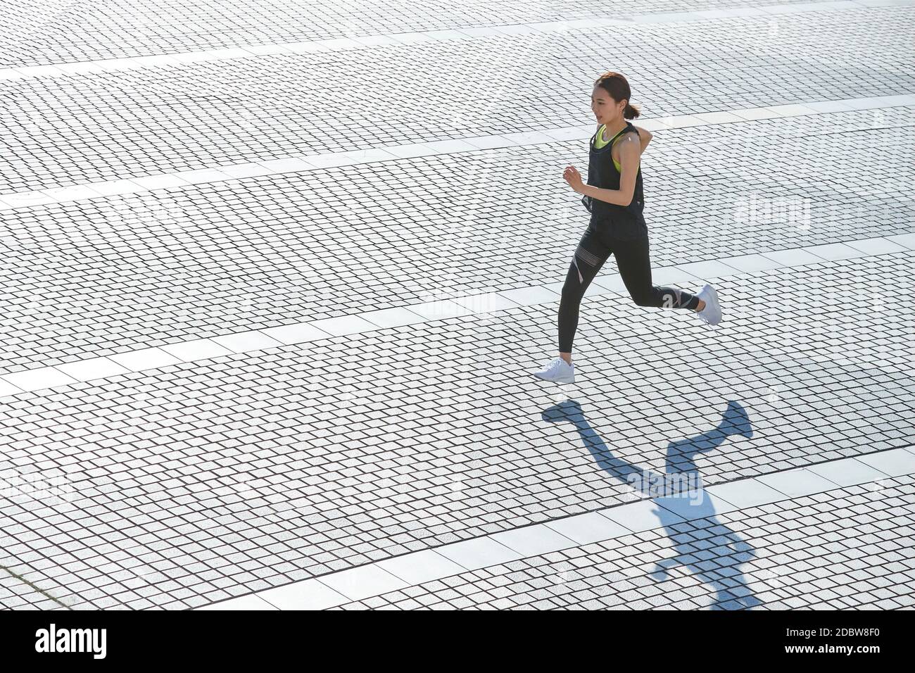 Young Japanese Woman Running Downtown Tokyo, Japan Stock Photo - Alamy