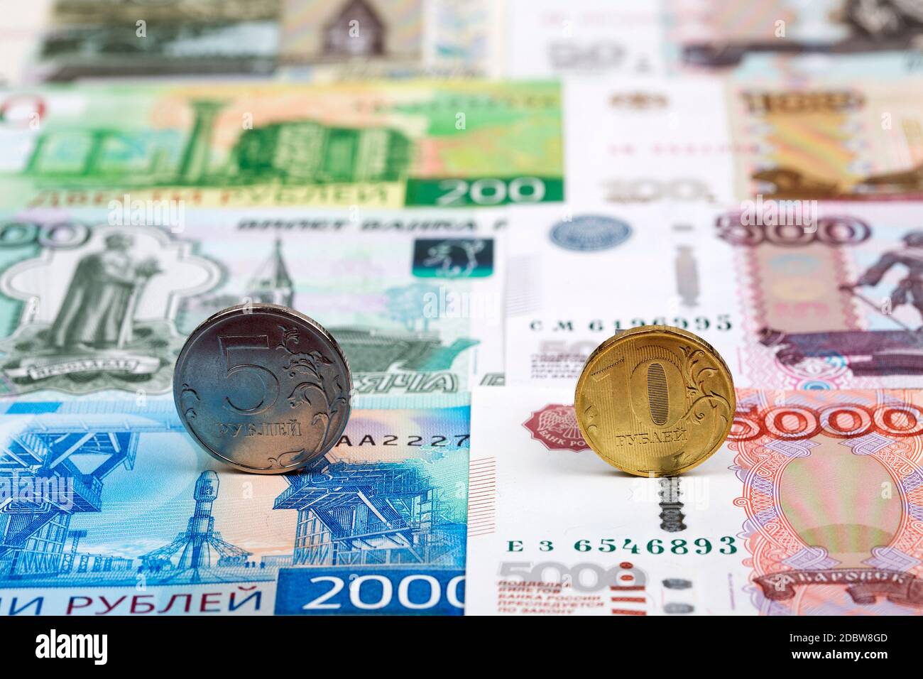Russian coins on the background of money Stock Photo - Alamy
