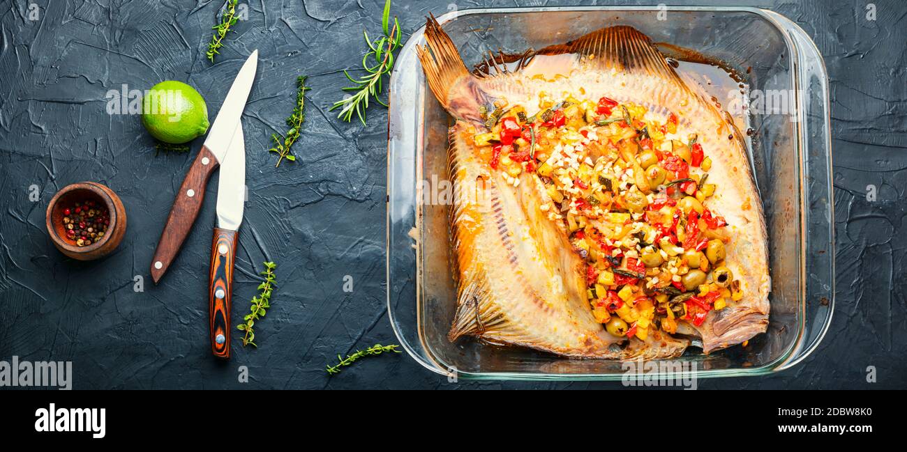 Plaice flounder or flat-fish baked with vegetables.Fried fish with ...
