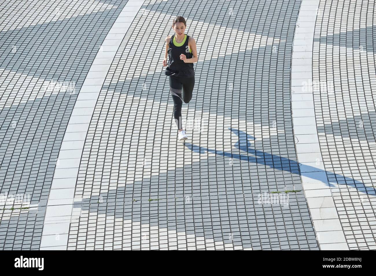 Young Japanese Woman Running Downtown Tokyo, Japan Stock Photo - Alamy