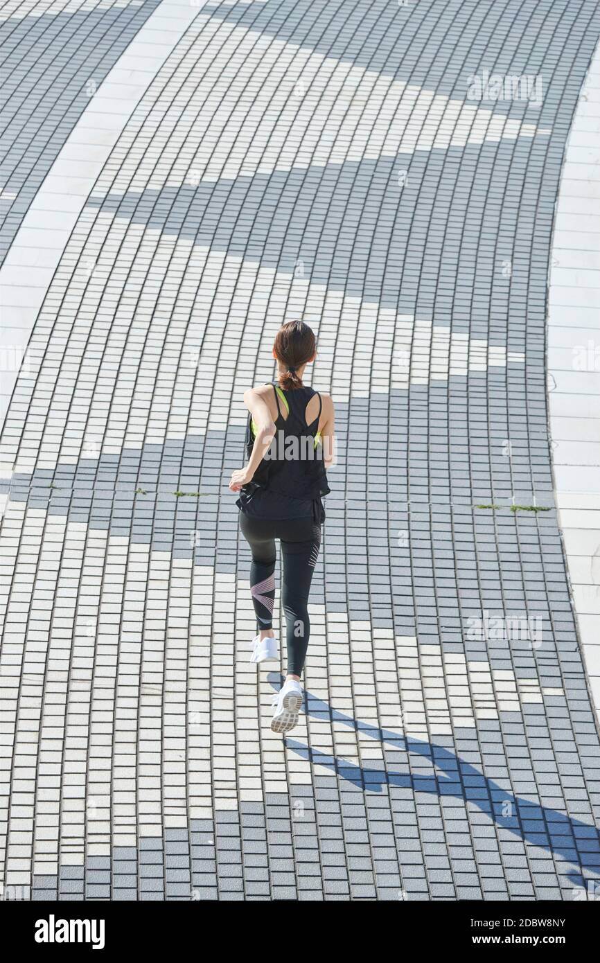 Young Japanese Woman Running Downtown Tokyo, Japan Stock Photo - Alamy