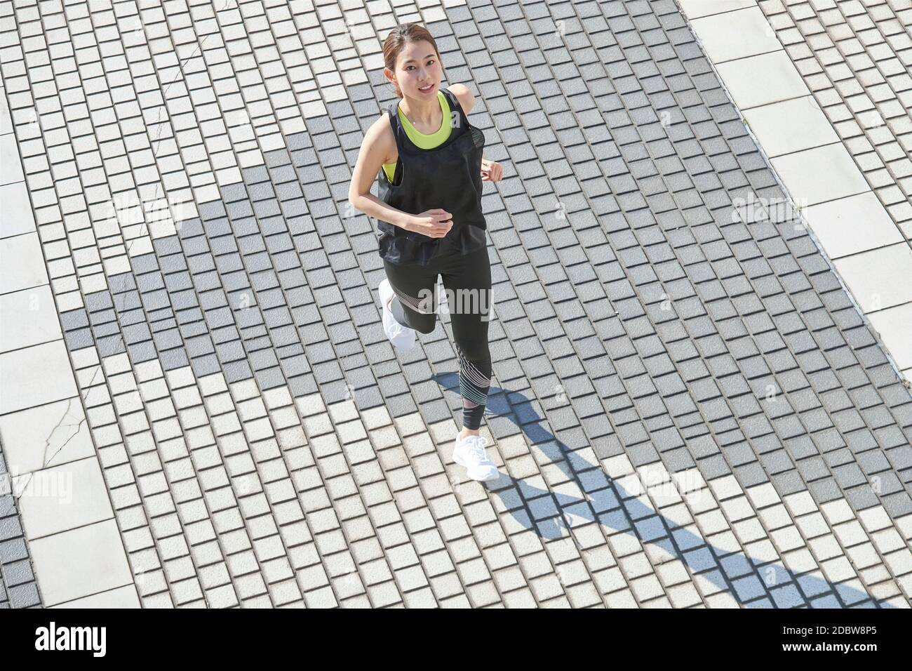 Young Japanese Woman Running Downtown Tokyo, Japan Stock Photo - Alamy