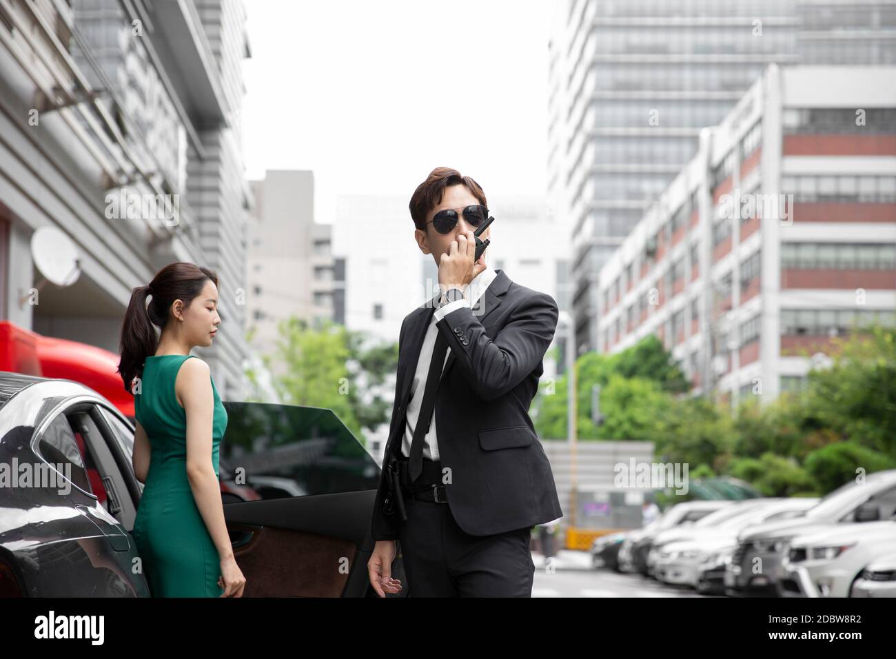Asian male and female two security guards 010 Stock Photo - Alamy