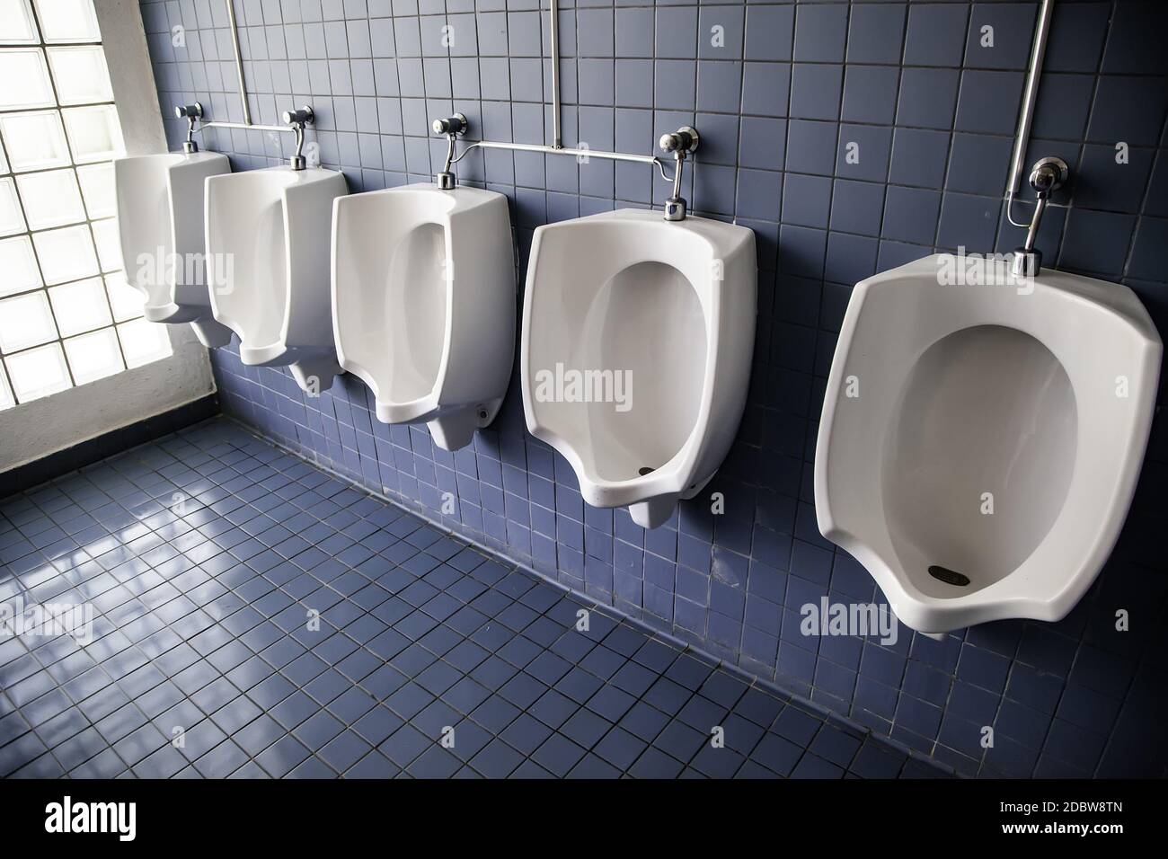 Male public toilets, hygiene and cleaning detail Stock Photo - Alamy