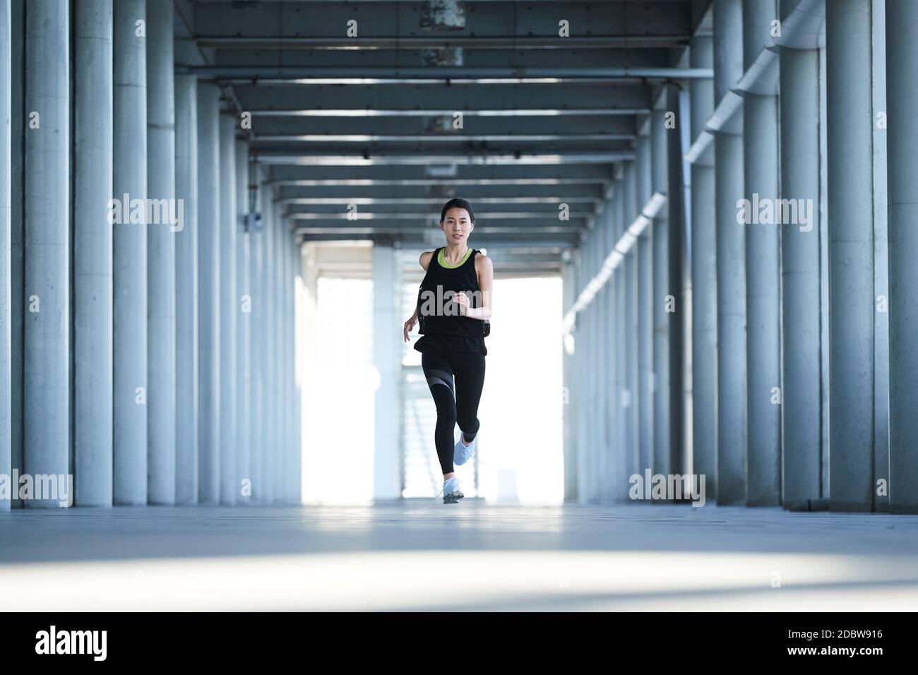 Young Japanese Woman Running Downtown Tokyo, Japan Stock Photo - Alamy