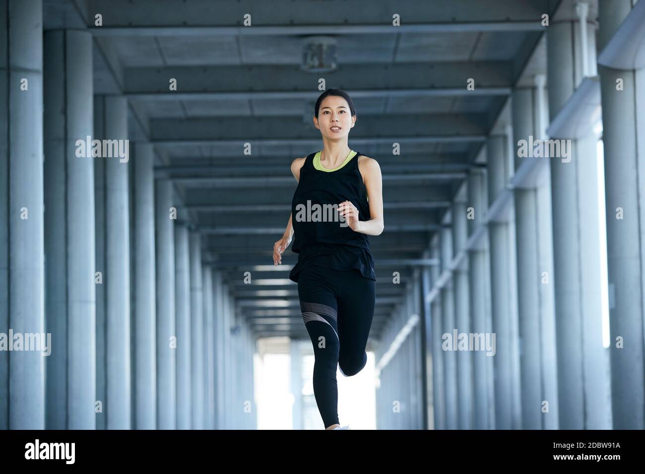 Young Japanese Woman Running Downtown Tokyo, Japan Stock Photo - Alamy
