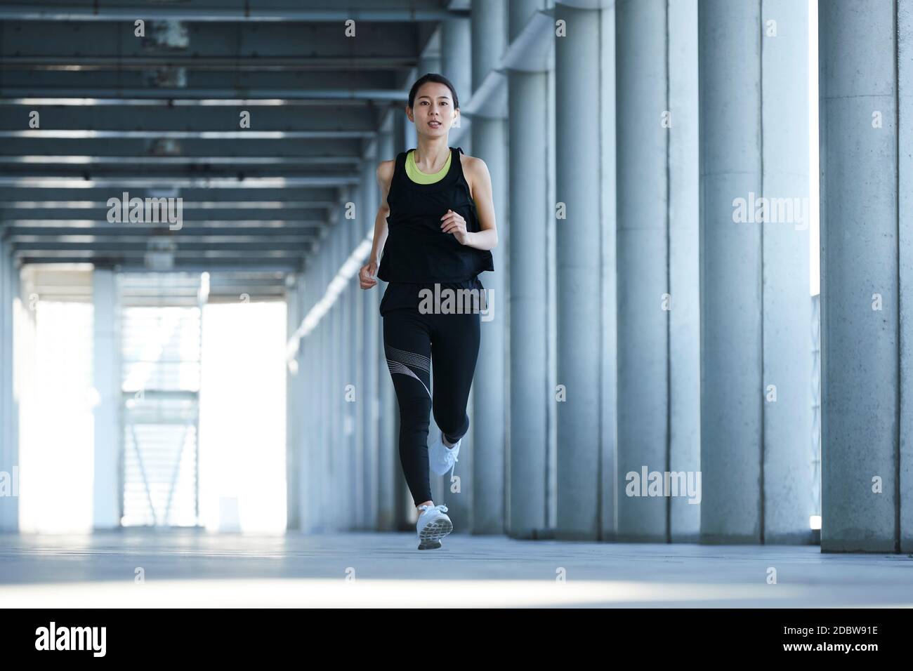 Young Japanese Woman Running Downtown Tokyo, Japan Stock Photo - Alamy