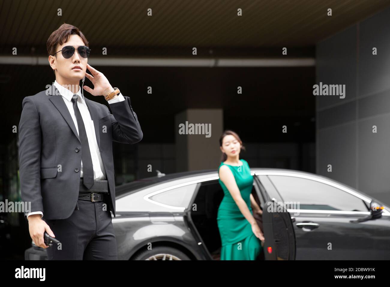 Asian male and female two security guards 012 Stock Photo - Alamy