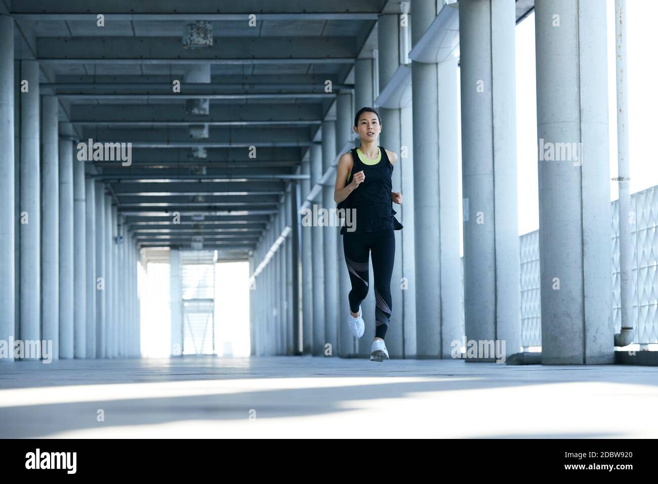 Young Japanese Woman Running Downtown Tokyo, Japan Stock Photo - Alamy
