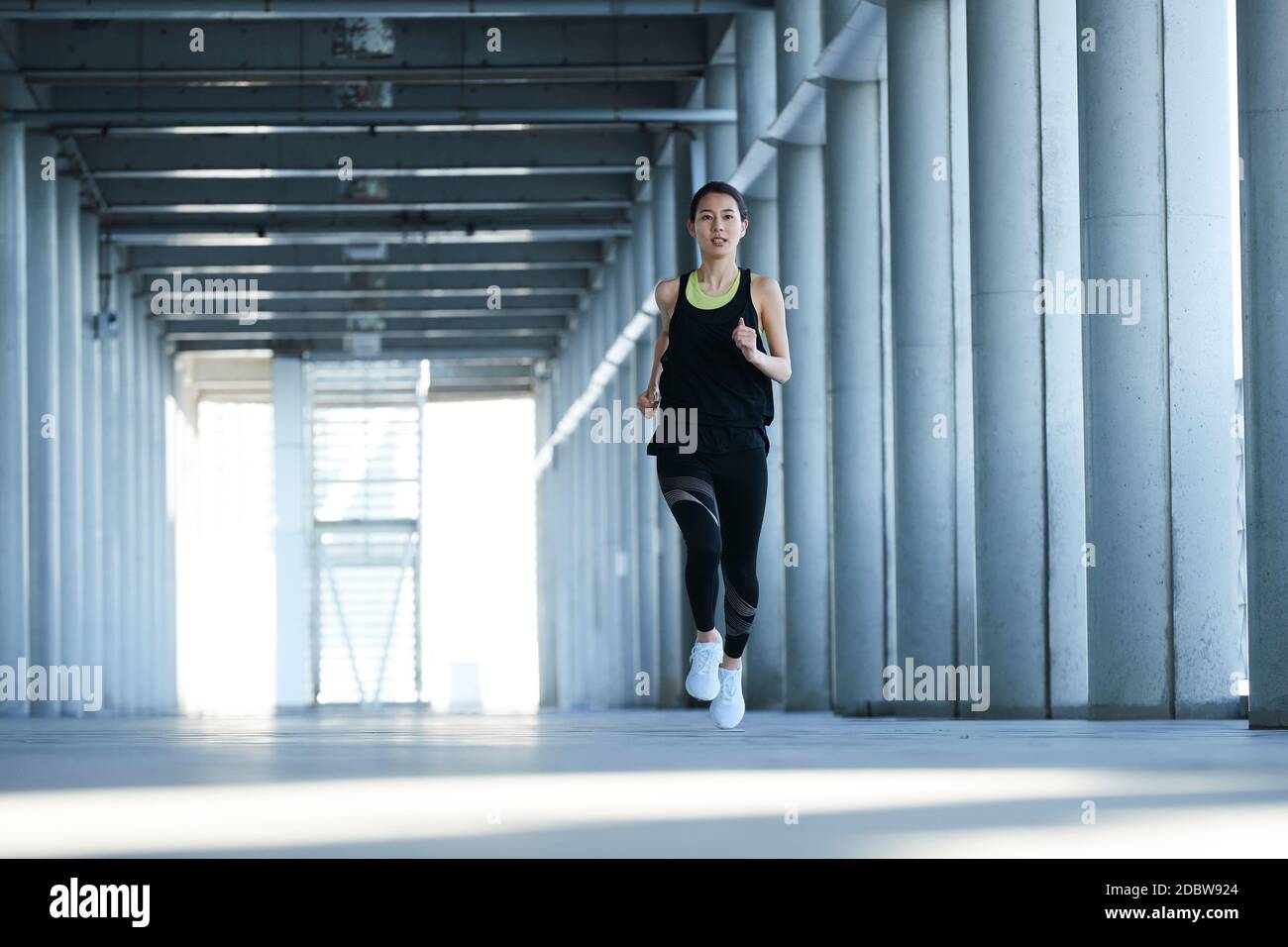 Young Japanese Woman Running Downtown Tokyo, Japan Stock Photo - Alamy