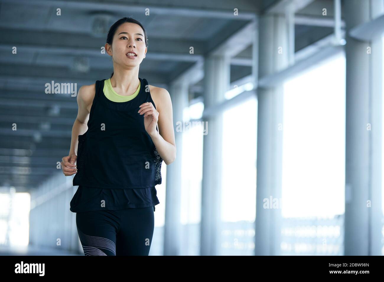 Young Japanese Woman Running Downtown Tokyo, Japan Stock Photo - Alamy