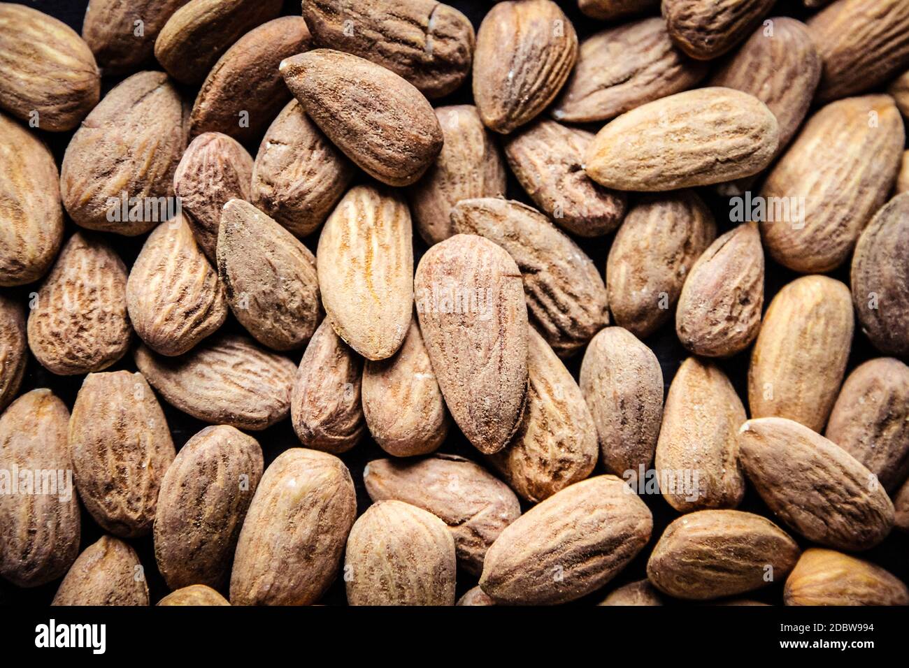 Fresh organic almond background wallpaper. Top view Stock Photo - Alamy