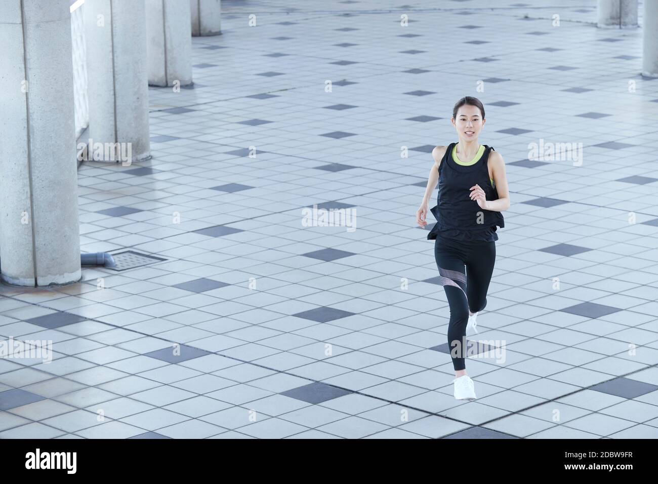 Young Japanese Woman Running Downtown Tokyo, Japan Stock Photo - Alamy