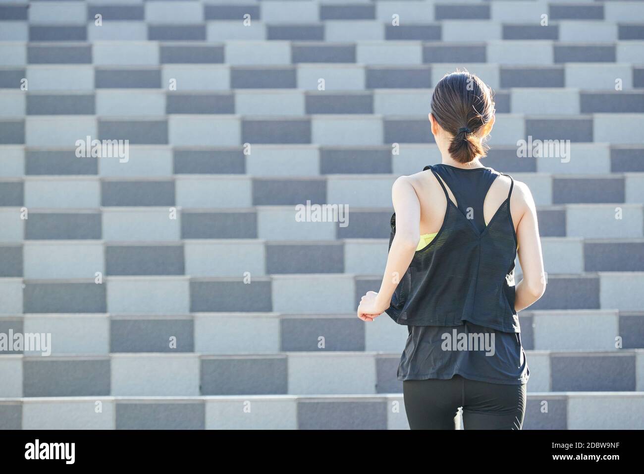 Young Japanese Woman Running Downtown Tokyo, Japan Stock Photo - Alamy