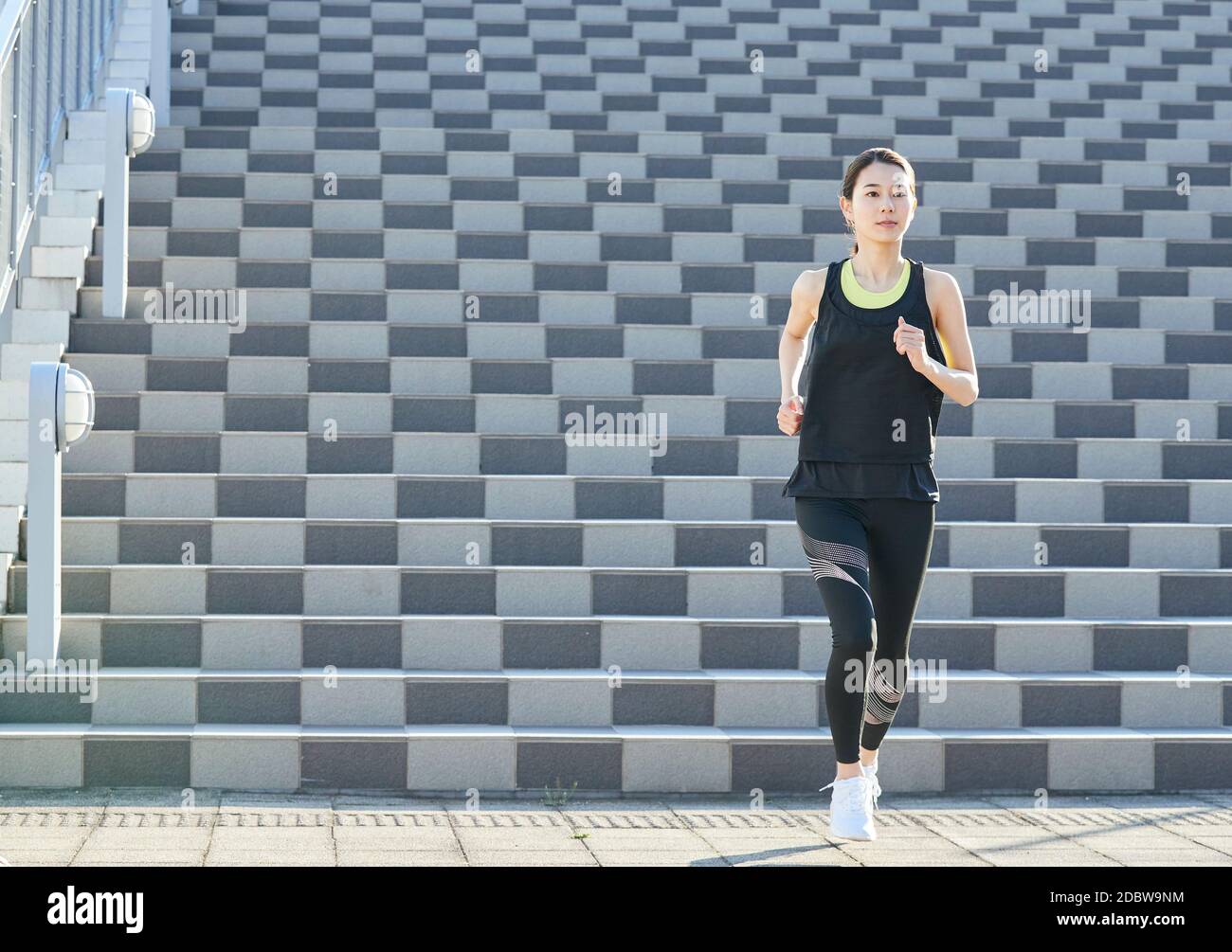 Young Japanese Woman Running Downtown Tokyo, Japan Stock Photo - Alamy