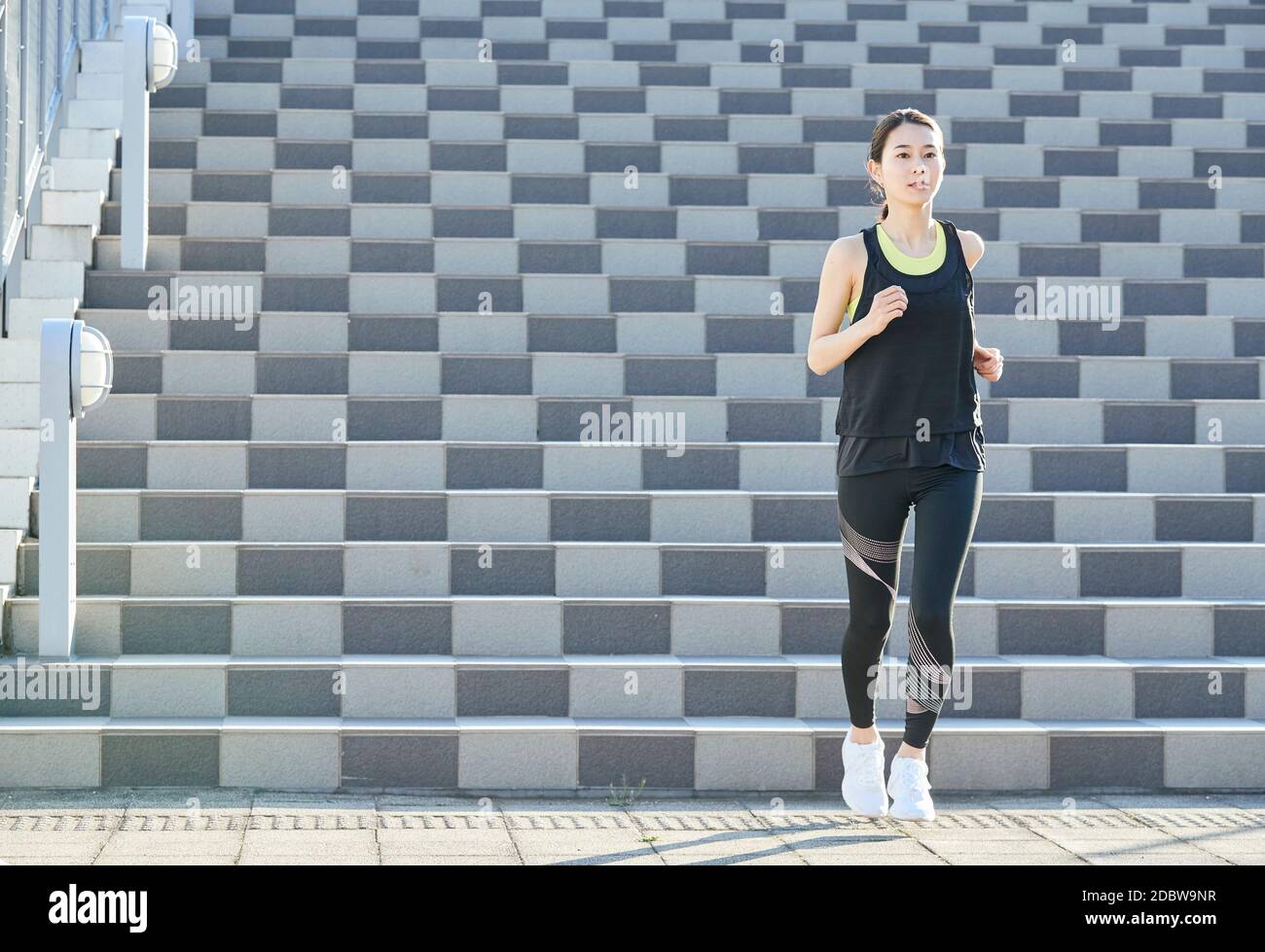 Young Japanese Woman Running Downtown Tokyo, Japan Stock Photo - Alamy