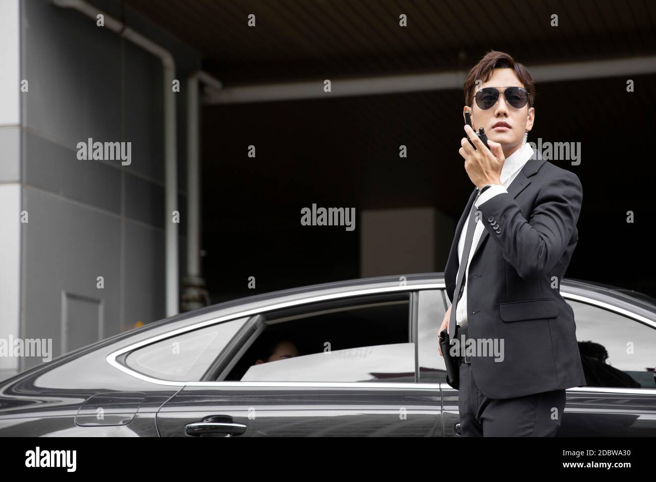 Asian male and female two security guards 016 Stock Photo - Alamy