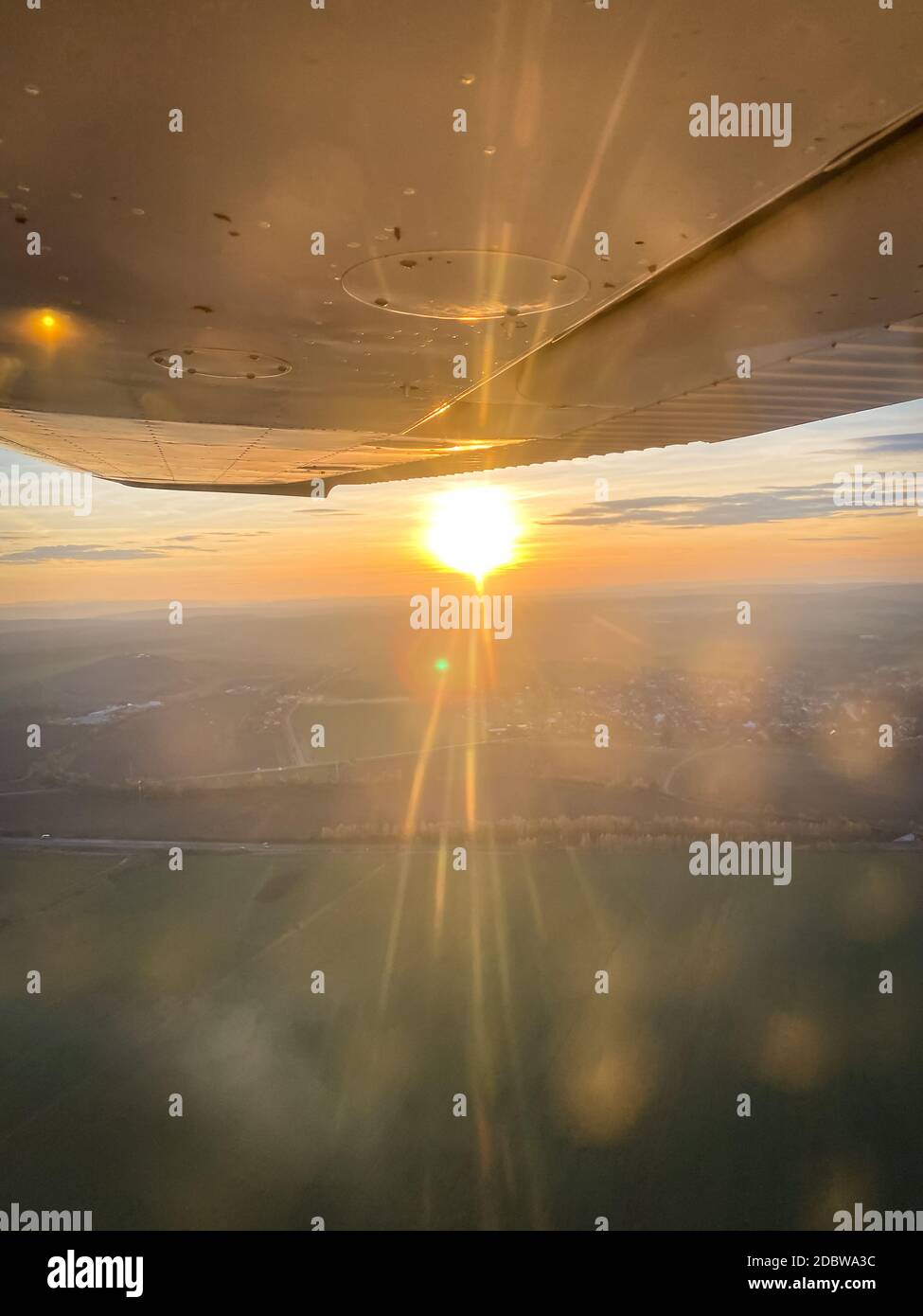 Beautiful aerial view of countryside during sunset from a Cessna Plane ...