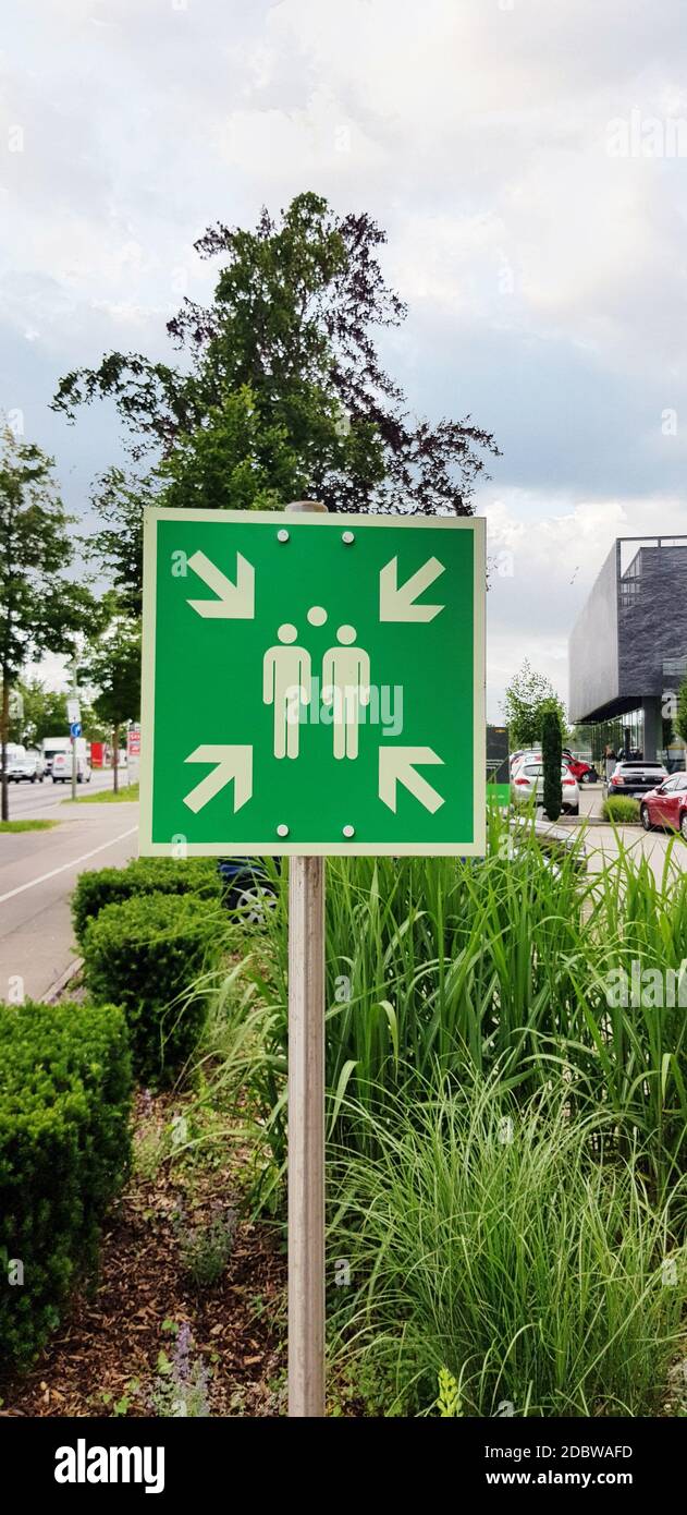 White assembly point sign on hi-res stock photography and images - Alamy