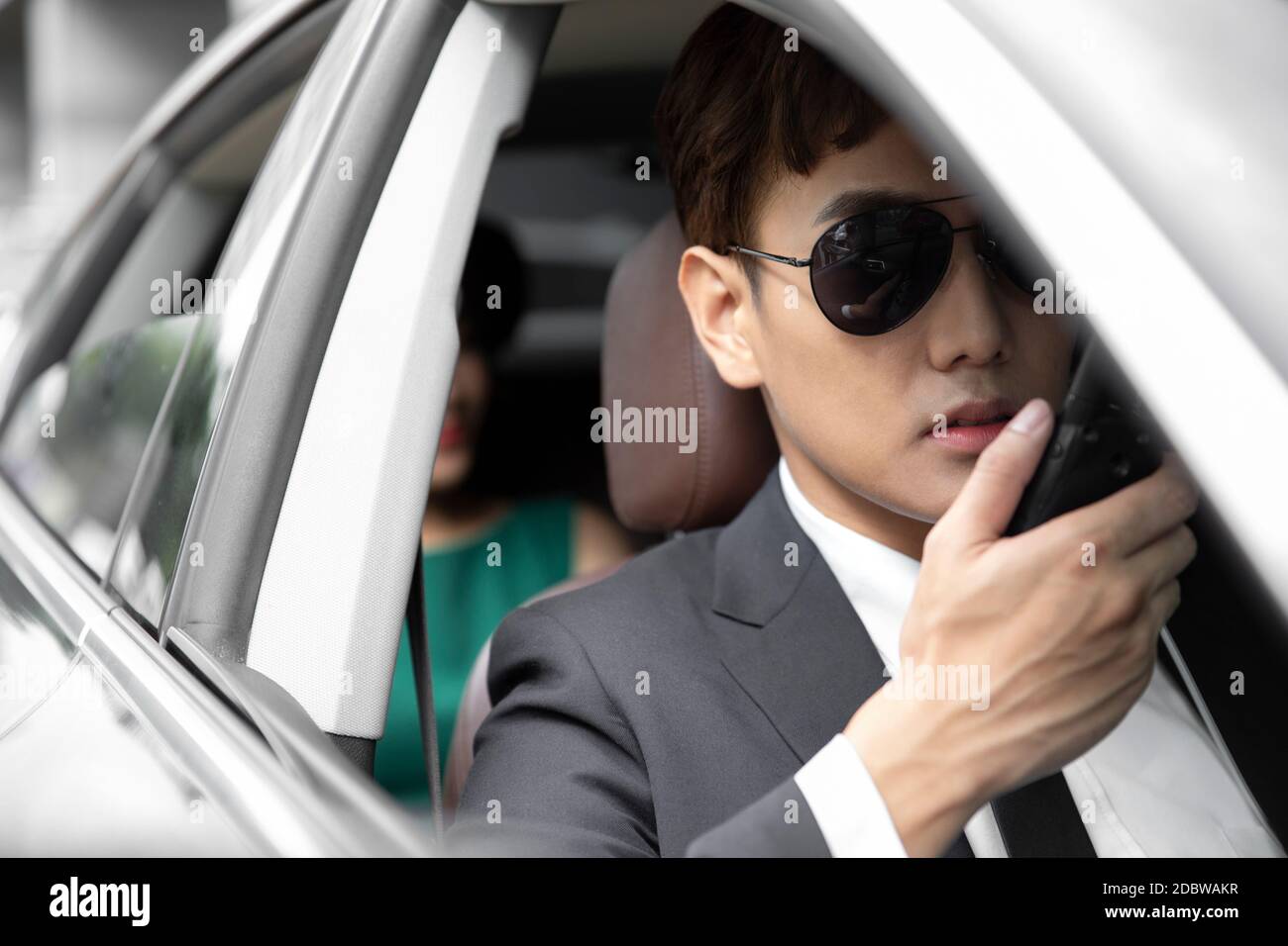 Asian male and female two security guards 021 Stock Photo - Alamy