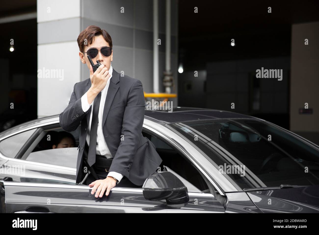 Asian male and female two security guards 022 Stock Photo - Alamy