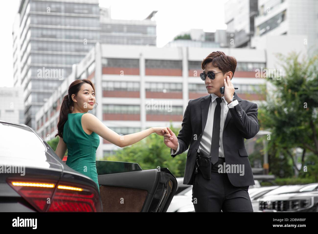 Asian male and female two security guards 025 Stock Photo - Alamy
