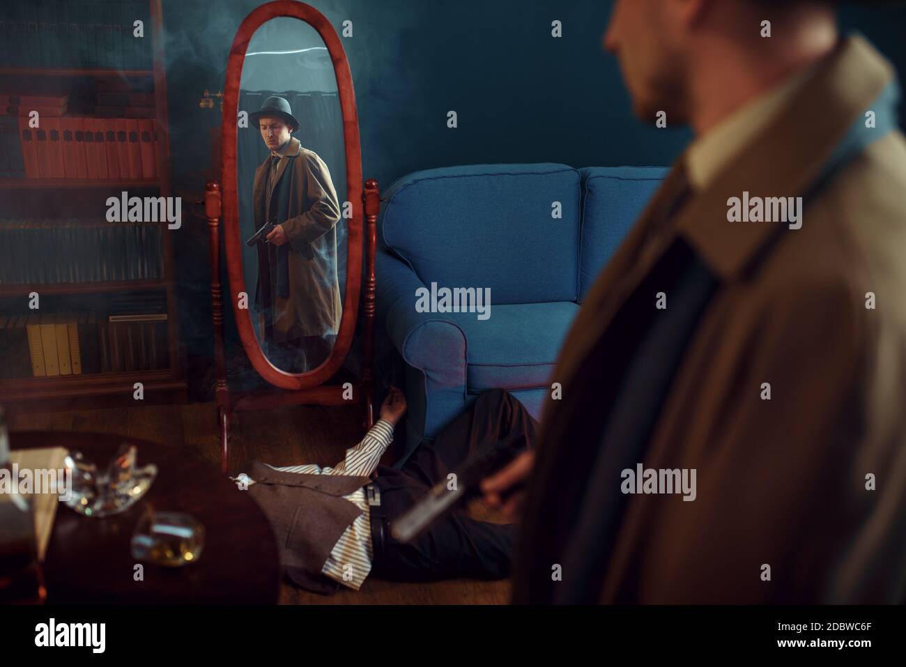Male detective with gun standing at the mirror, crime scene, retro ...