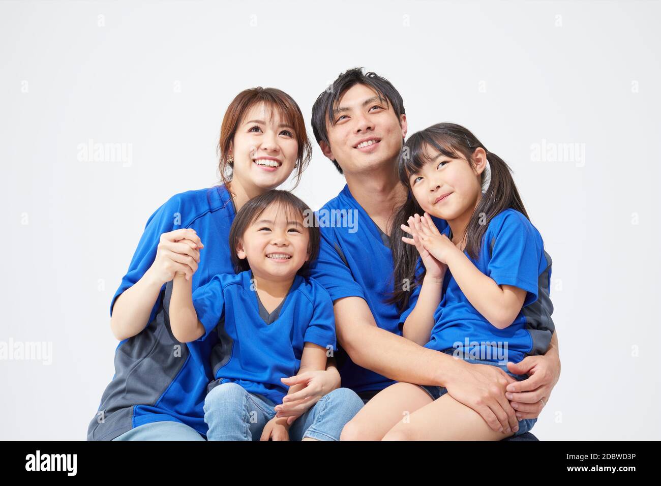 Family Watching A Game And Cheering Stock Photo - Alamy