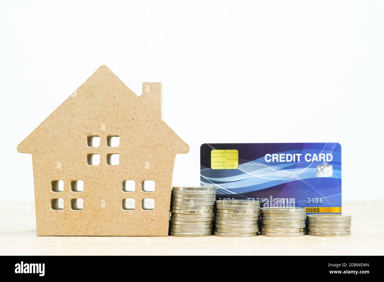 House model and and credit card on table for finance and banking ...