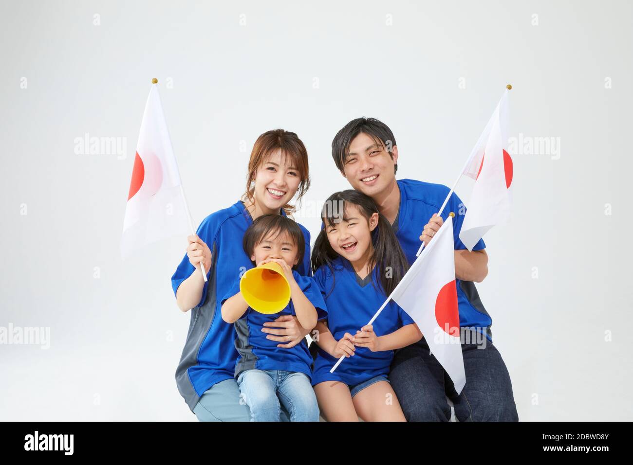 Family Watching A Game And Cheering Stock Photo - Alamy