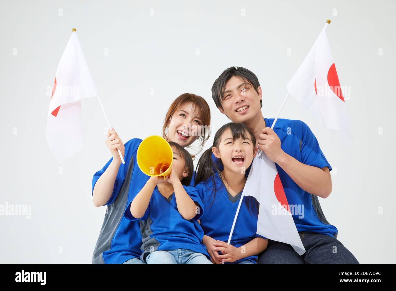 Family Watching A Game And Cheering Stock Photo - Alamy