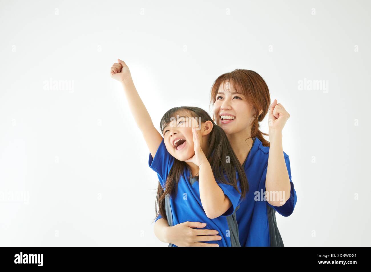 Family Watching A Game And Cheering Stock Photo - Alamy