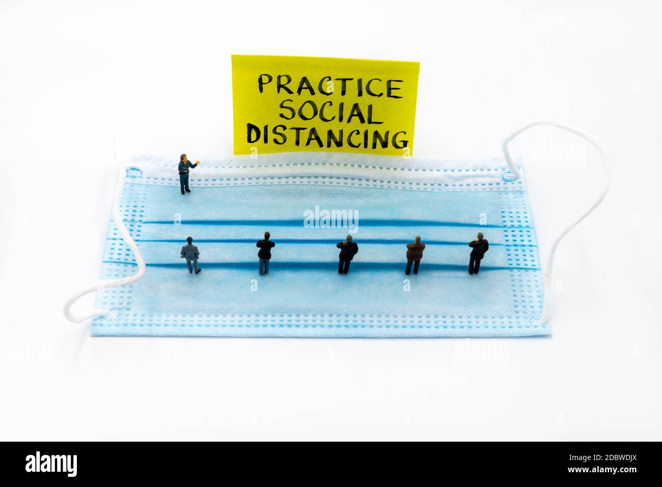 Miniature figurines posed as business people standing socially ...