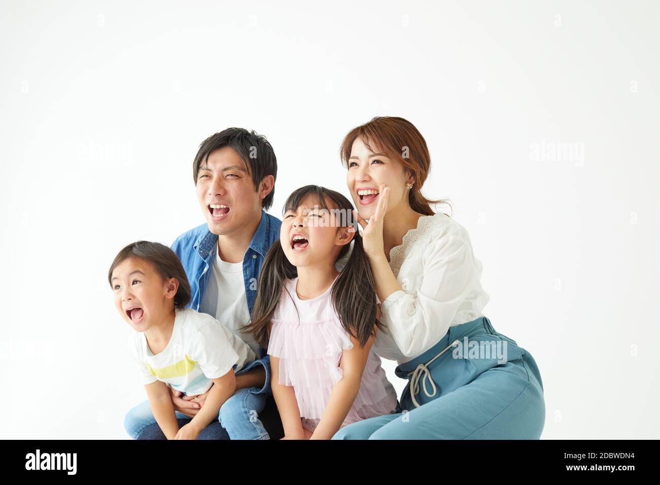 Family Watching A Game And Cheering Stock Photo - Alamy