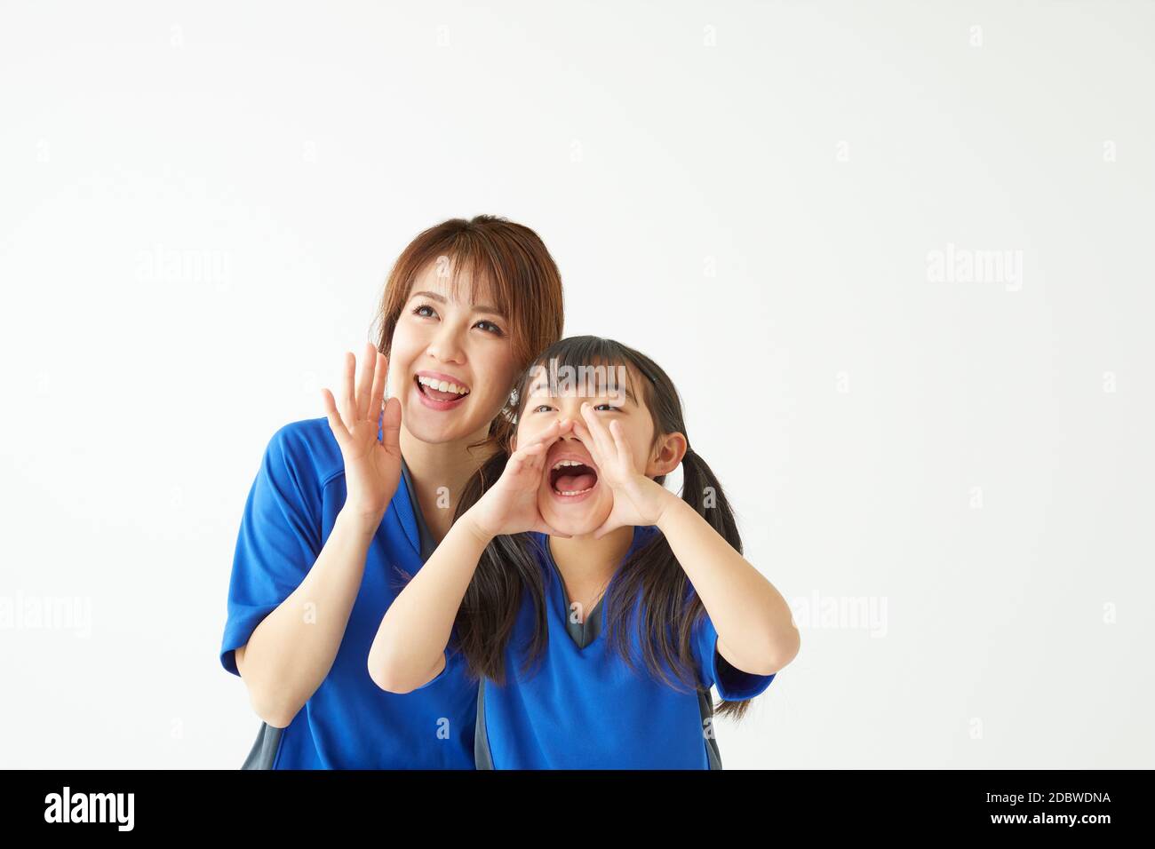 Family Watching A Game And Cheering Stock Photo - Alamy