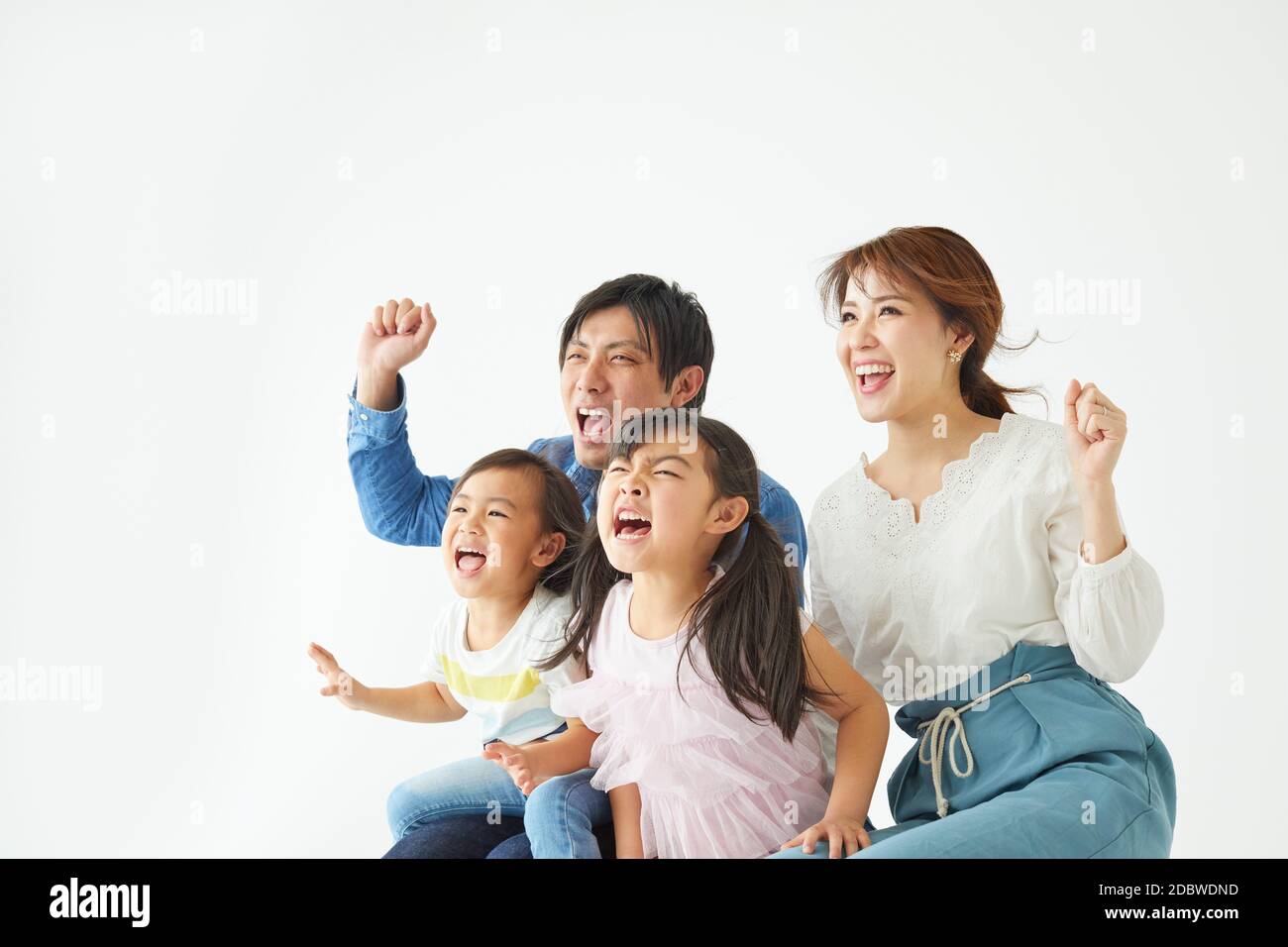 Family Watching A Game And Cheering Stock Photo - Alamy