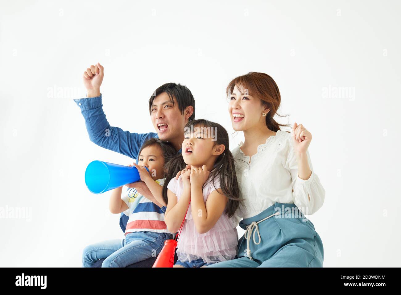 Family Watching A Game And Cheering Stock Photo - Alamy