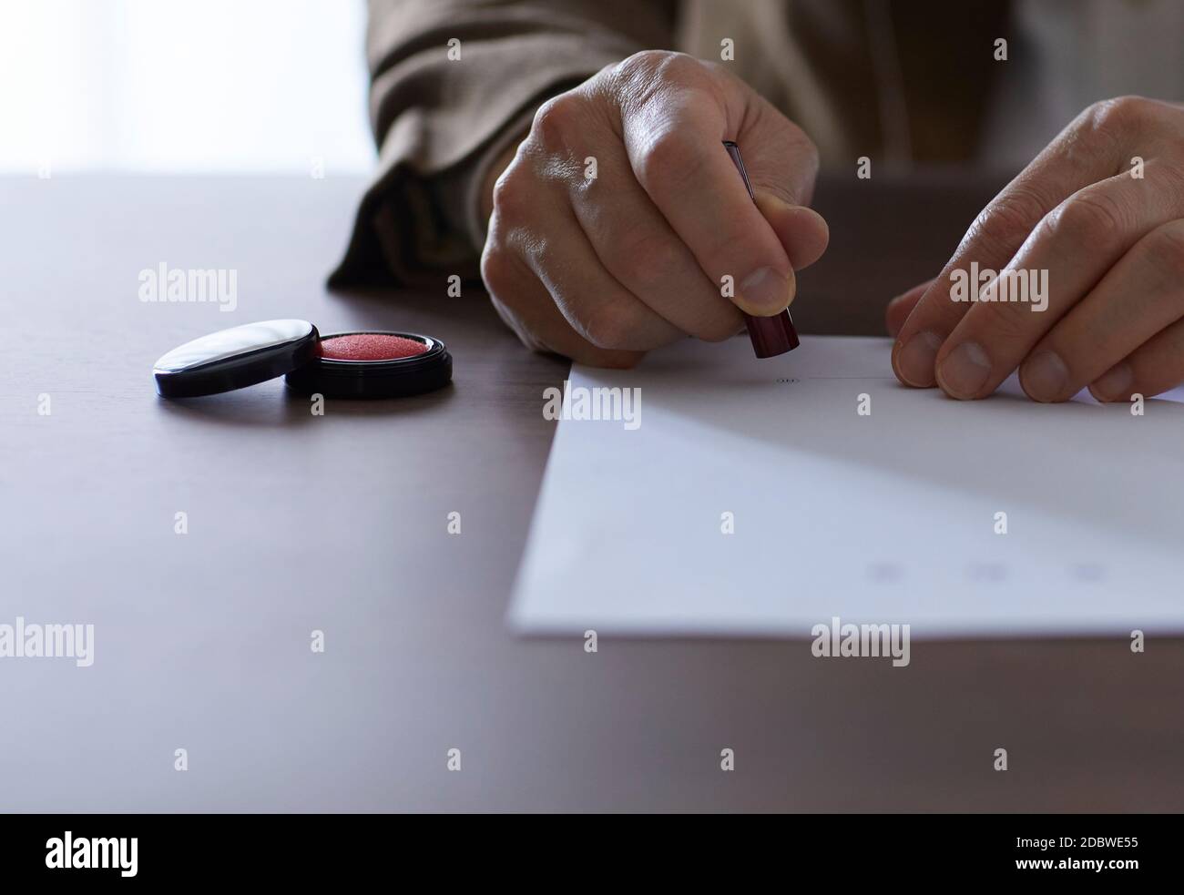 Man Putting Seal Stock Photo - Alamy