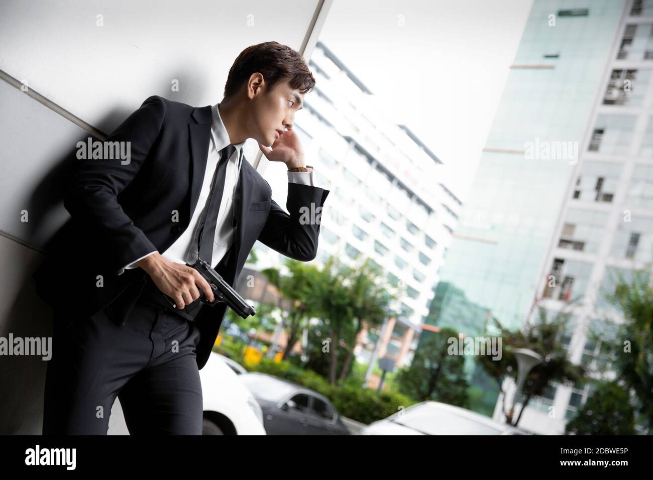 Asian male and female two security guards 039 Stock Photo - Alamy