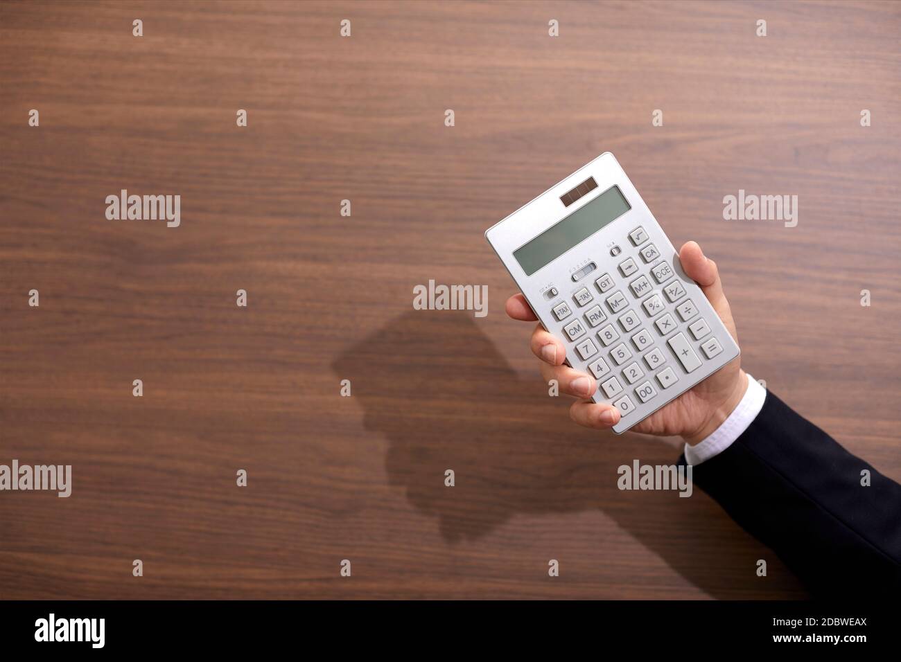 Hand Holding An Electronic Calculator Stock Photo - Alamy