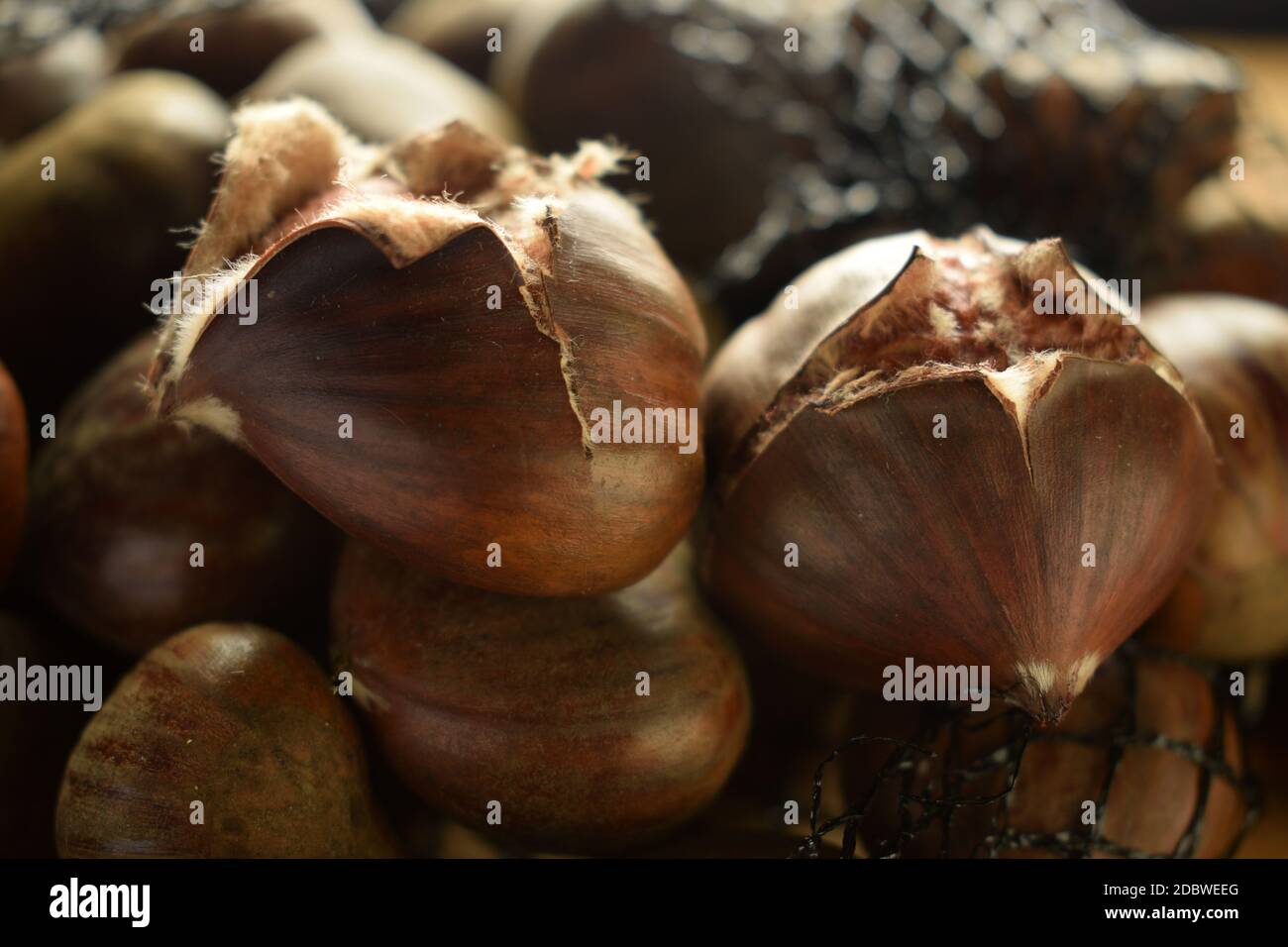 Closeup of roasted chestnuts with the typical cut for cooking Stock ...