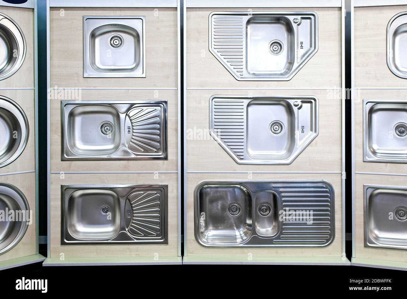 Display of stainless steel kitchen sinks samples Stock Photo - Alamy
