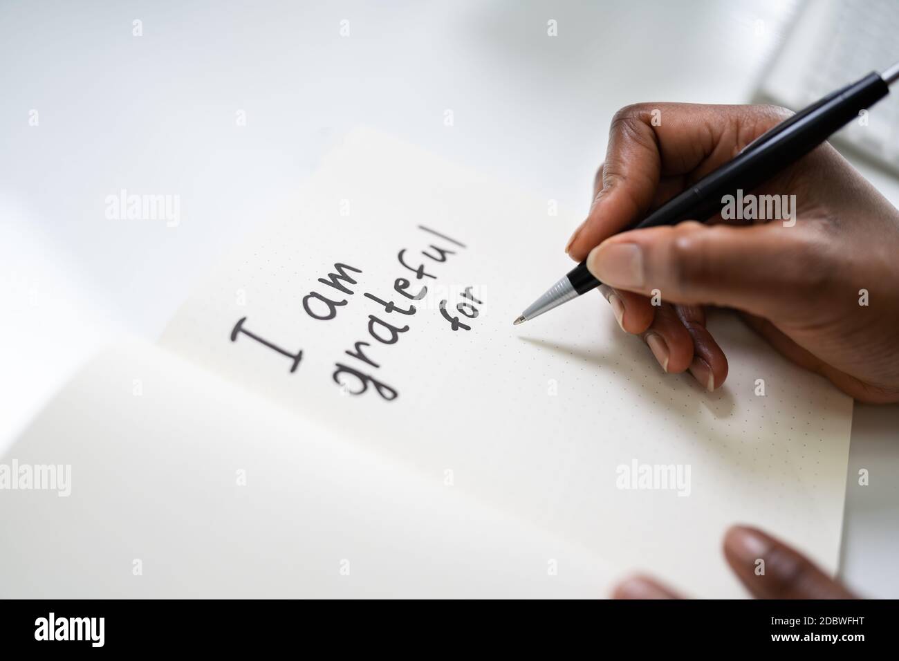 African American Women Writing In Gratitude Journal Stock Photo - Alamy