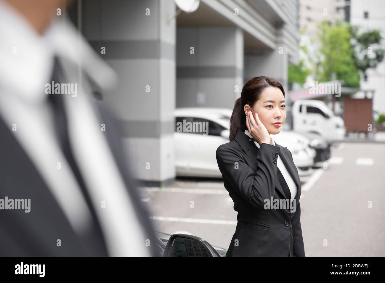 Asian male and female two security guards 046 Stock Photo - Alamy